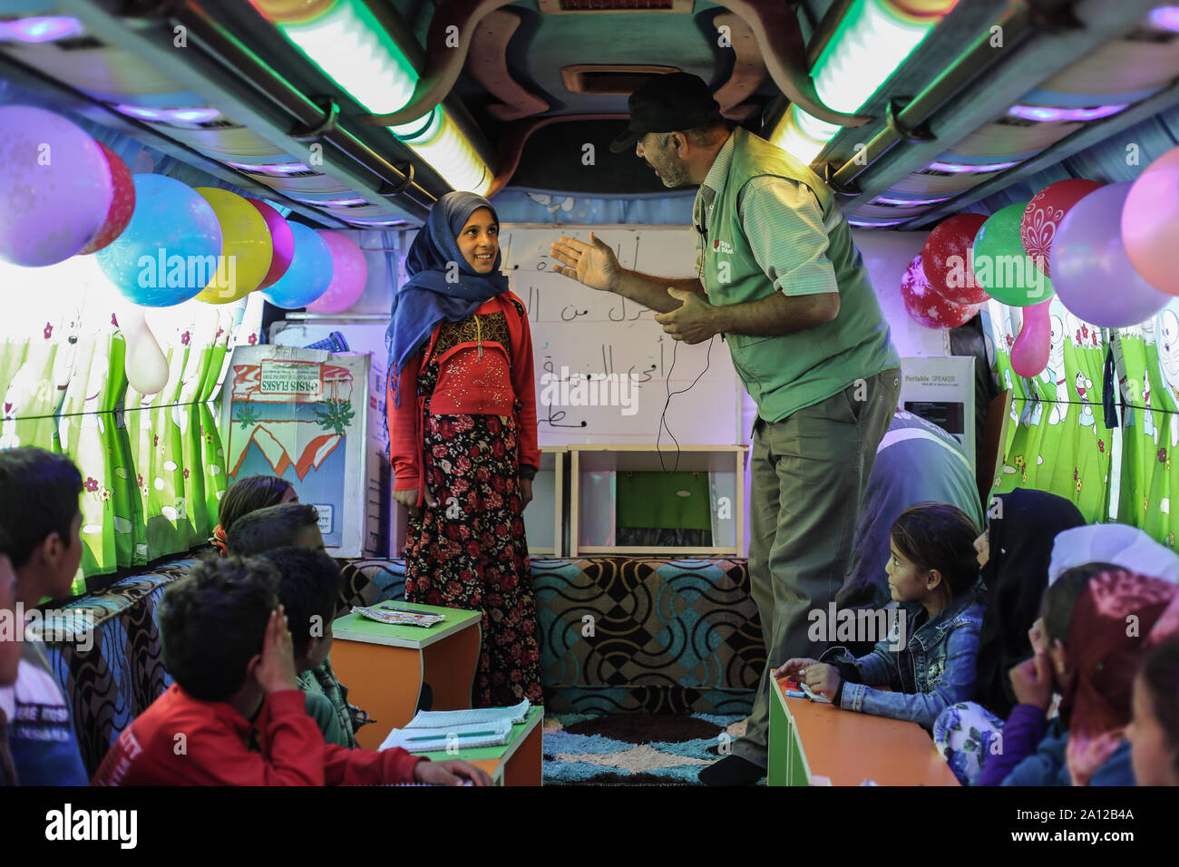 22 September 2019, Syria, Hazano: A Syrian teacher interacts with a ...