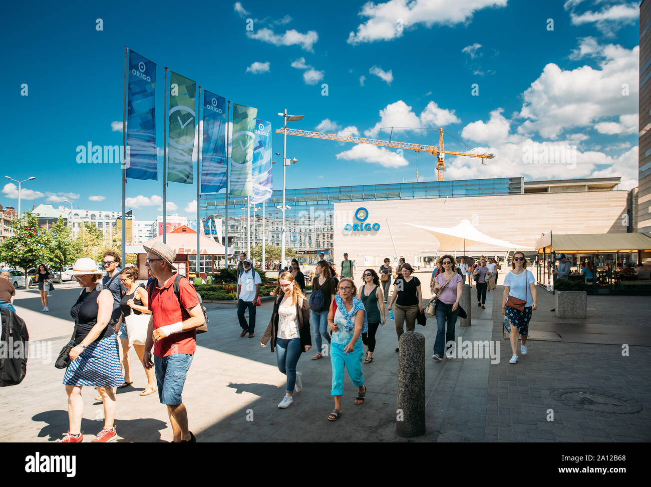 Riga, Latvia - June 9, 2019: People Walking Near Origo Shopping Mall ...