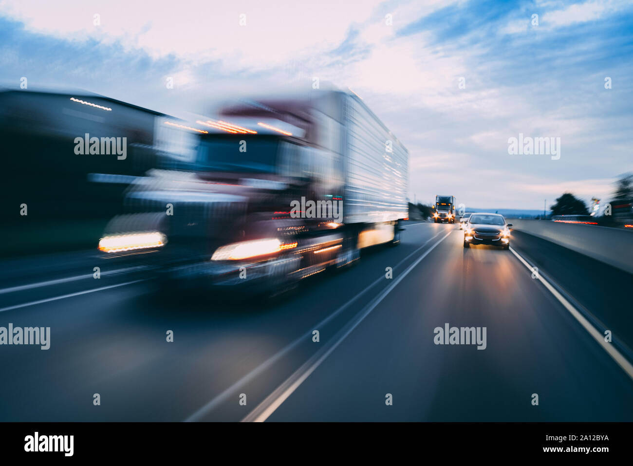 Semi truck on highway concept with motion blur Stock Photo - Alamy