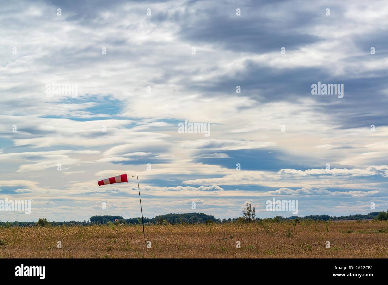 Lonely windsock at the empty airfield. Bad weather prediction Stock ...