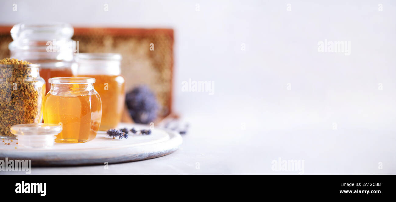 Honey products background. Honeycomb frame, bee pollen granules, honey ...