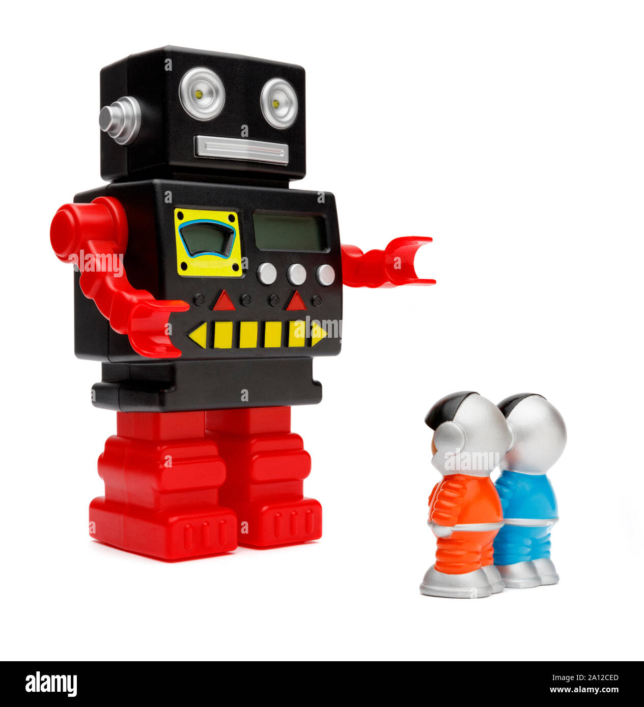 A toy robot meets two spacemen to say hello, isolated and shot on a ...