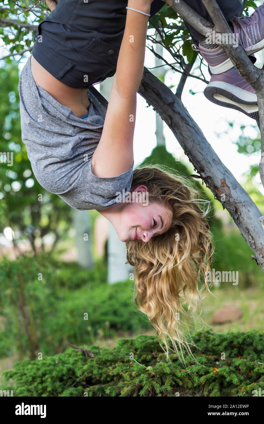 Girls hanging upside down hi-res stock photography and images - Alamy