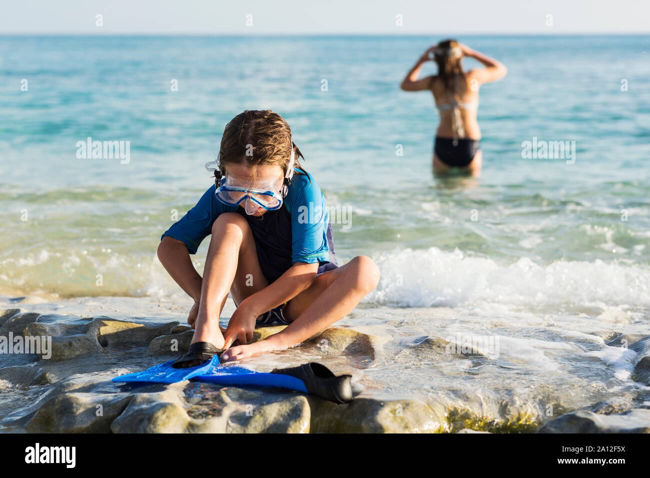 Putting on flippers hi-res stock photography and images - Alamy