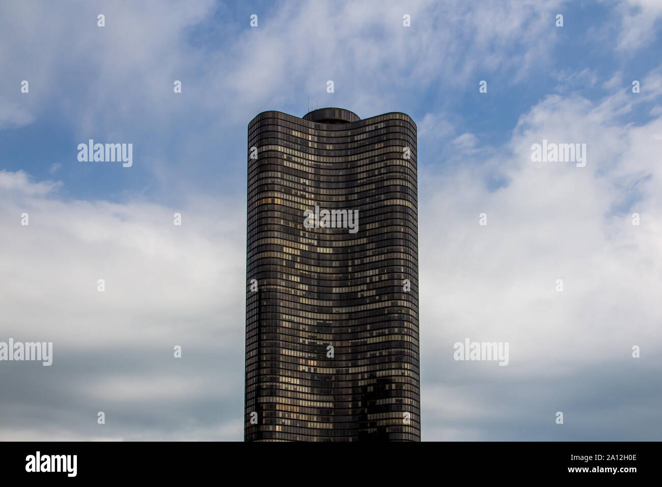 Curved Building Against Cloudy Sky Stock Photo - Alamy
