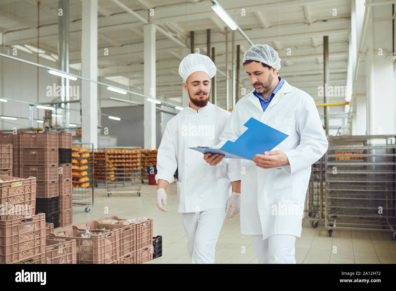 Woman baking bread in a factory hi-res stock photography and images - Alamy