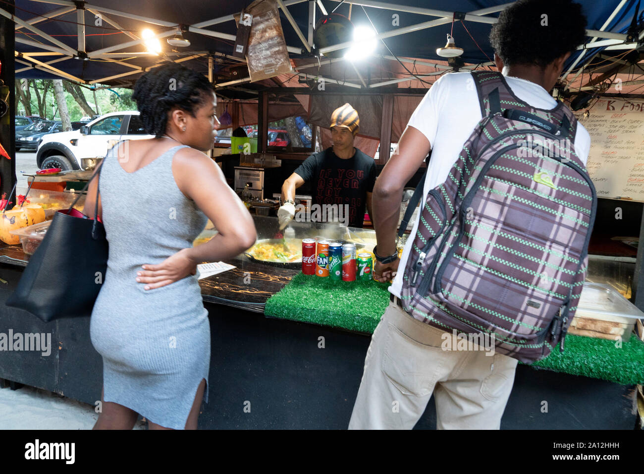 MAHE, SEYCHELLES - AUGUST 13 2019 - Young creole people at local market ...