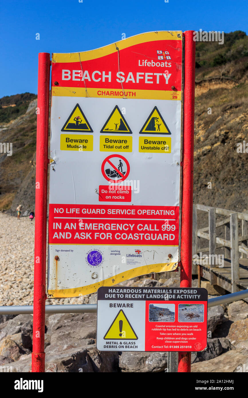 charmouth seaside resort beach safety signs, crumbling cliff strata ...