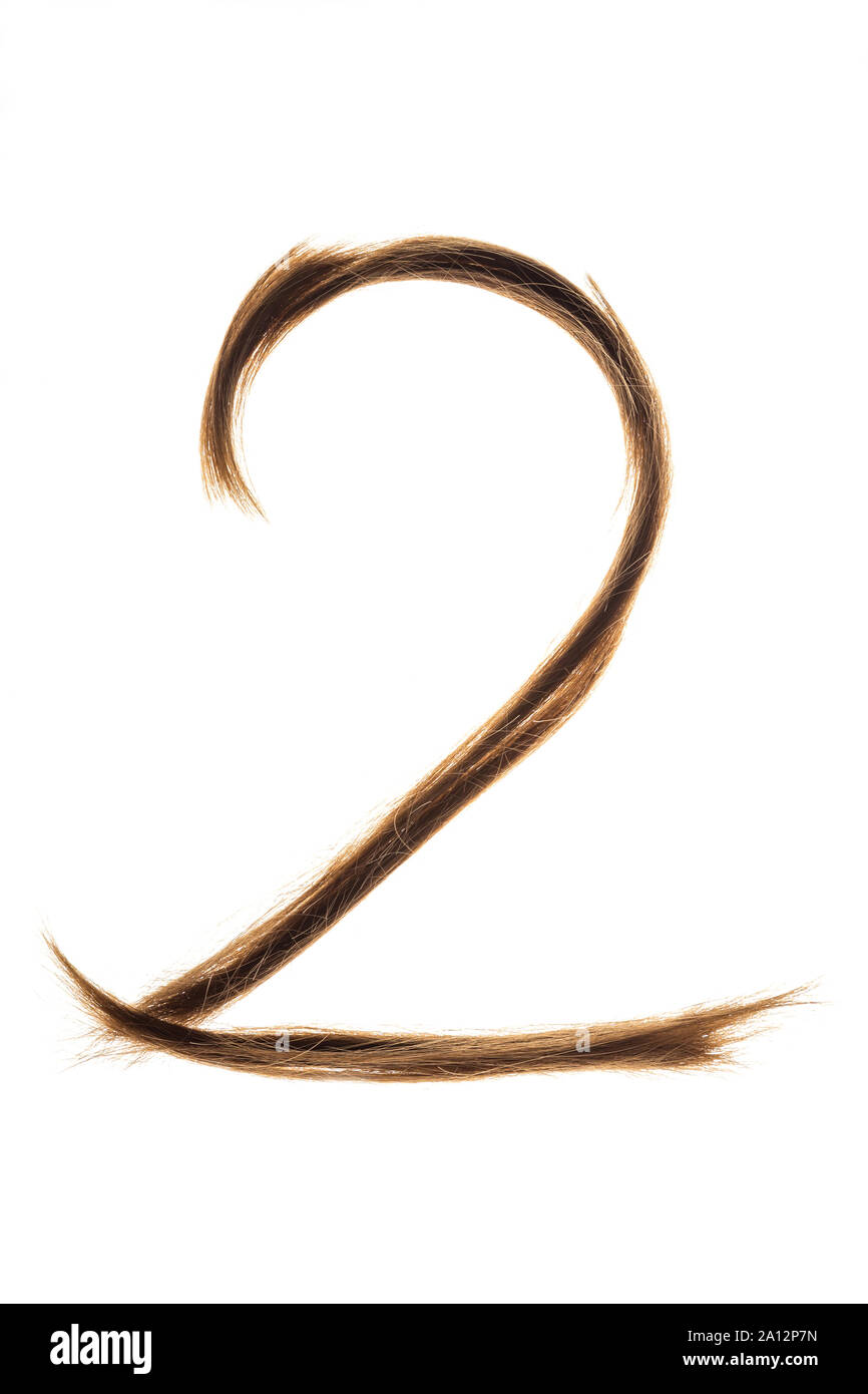 Number 2 made from cut out woman hair, isolated on white background ...