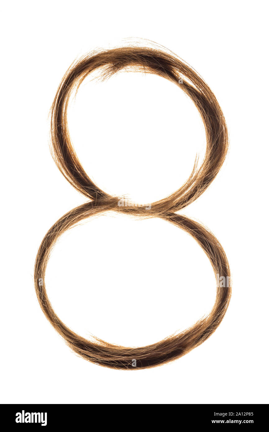 Number 8 made from cut out woman hair, isolated on white background ...