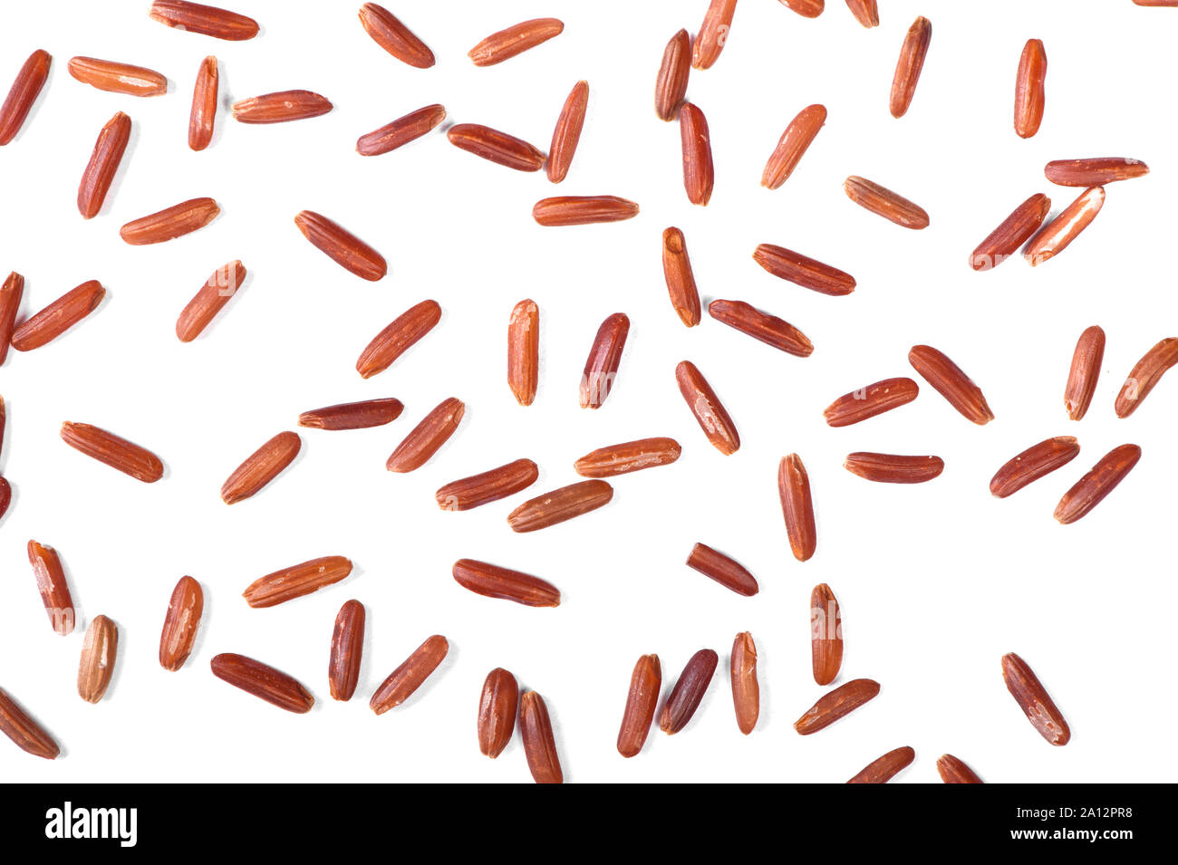 Seeds of raw dry brown rice isolated on white background Stock Photo ...