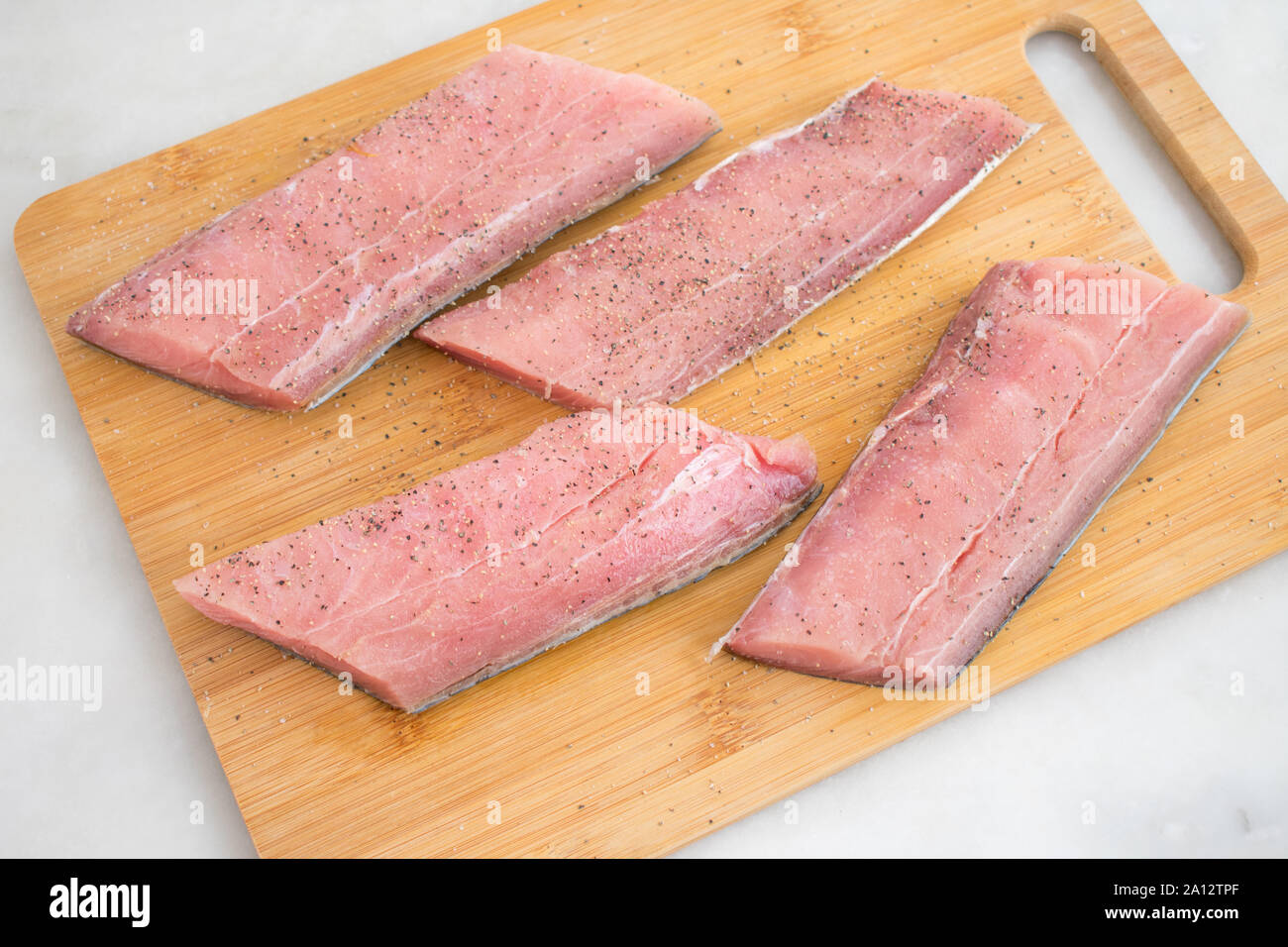 Raw Mahi Mahi (Dolphin Fish) Fillets on a Cutting Board: Raw fish ...