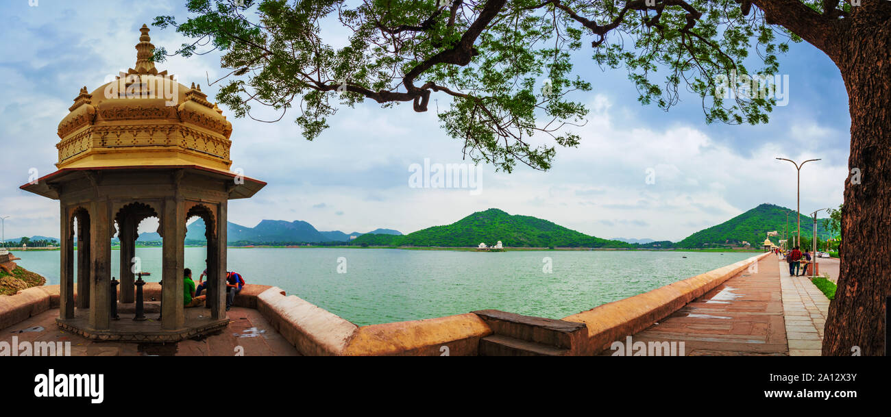 Wet roads across fateh sagar lake in Udaipur RAJASTHAN India , famous ...
