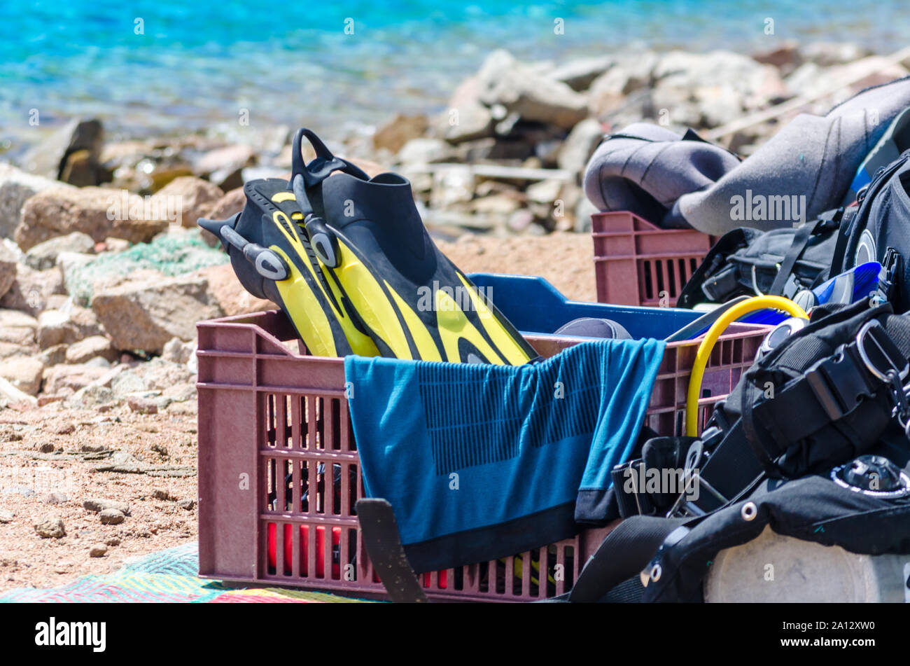 diving equipment in a crate on the beach in Egypt Stock Photo - Alamy
