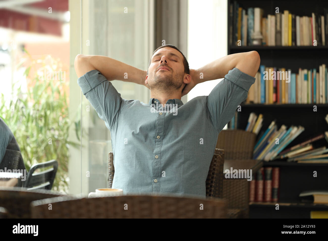Man resting head on arms hi-res stock photography and images - Alamy