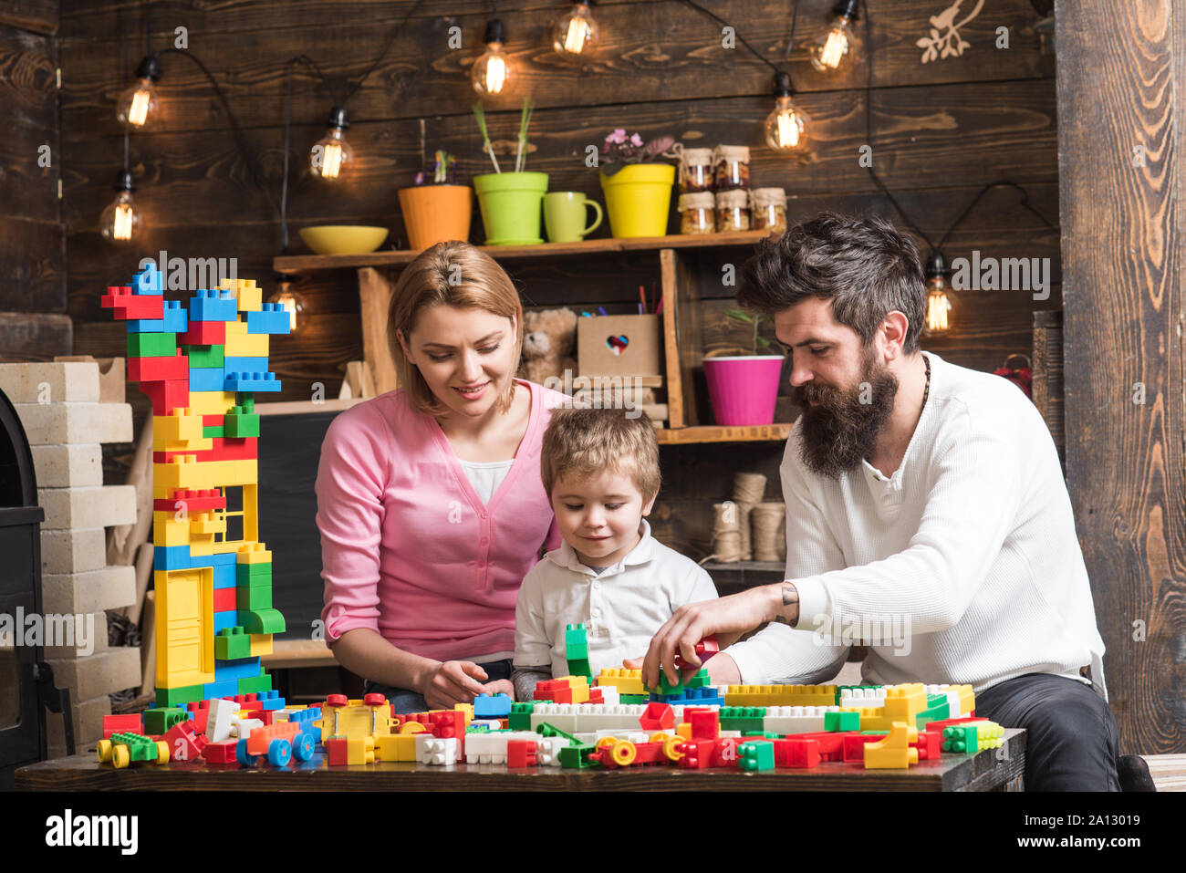 happy family playing with constructor at home. mother and father ...