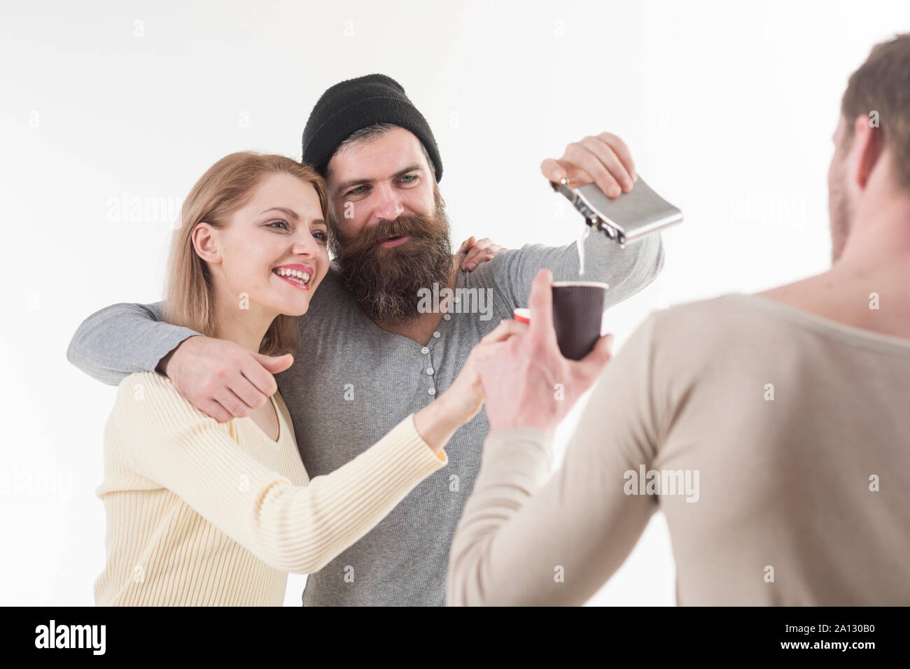 happy young people , drinking alcohol, close up hands toasting, having ...