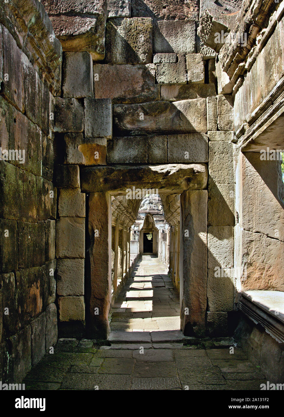 Between the walls of one of the Angkor temples Stock Photo - Alamy