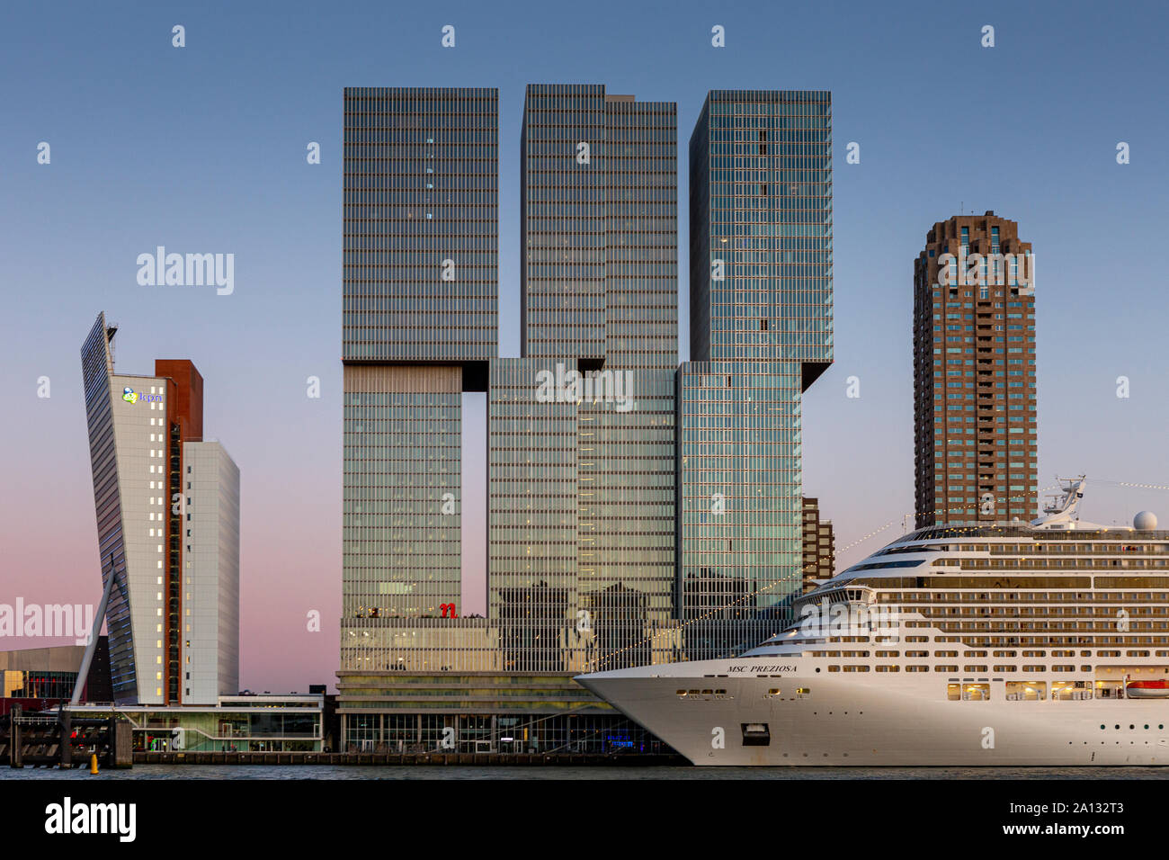 Cruise ship MSC Preziosa in front of the iconic Dutch port city skyline ...