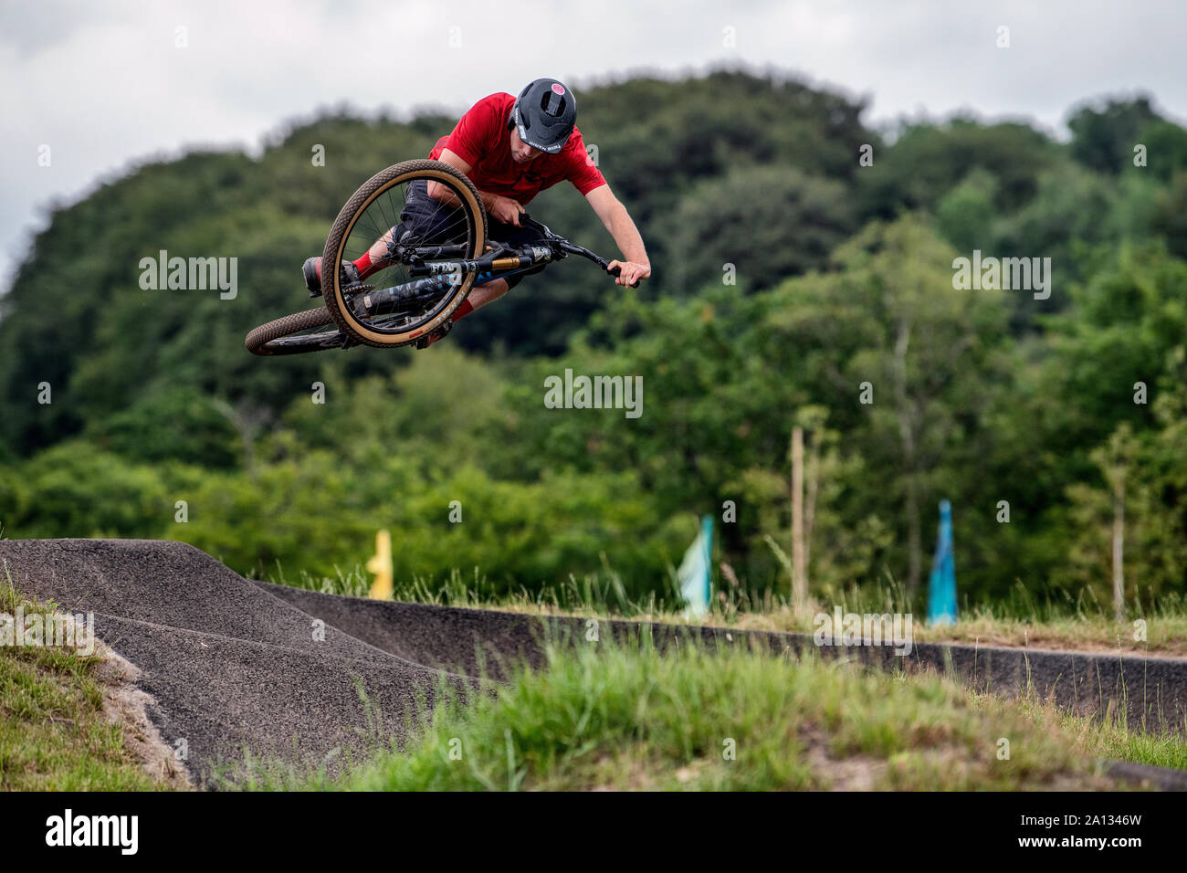 A man rides a mountain bike on a tarmac pump track at Mountain View ...