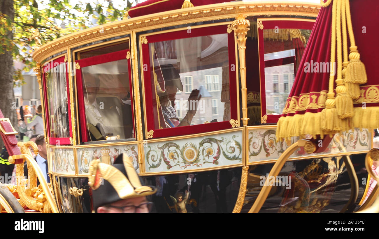 King and queen of the Dutch royal family waving and smiling to the ...