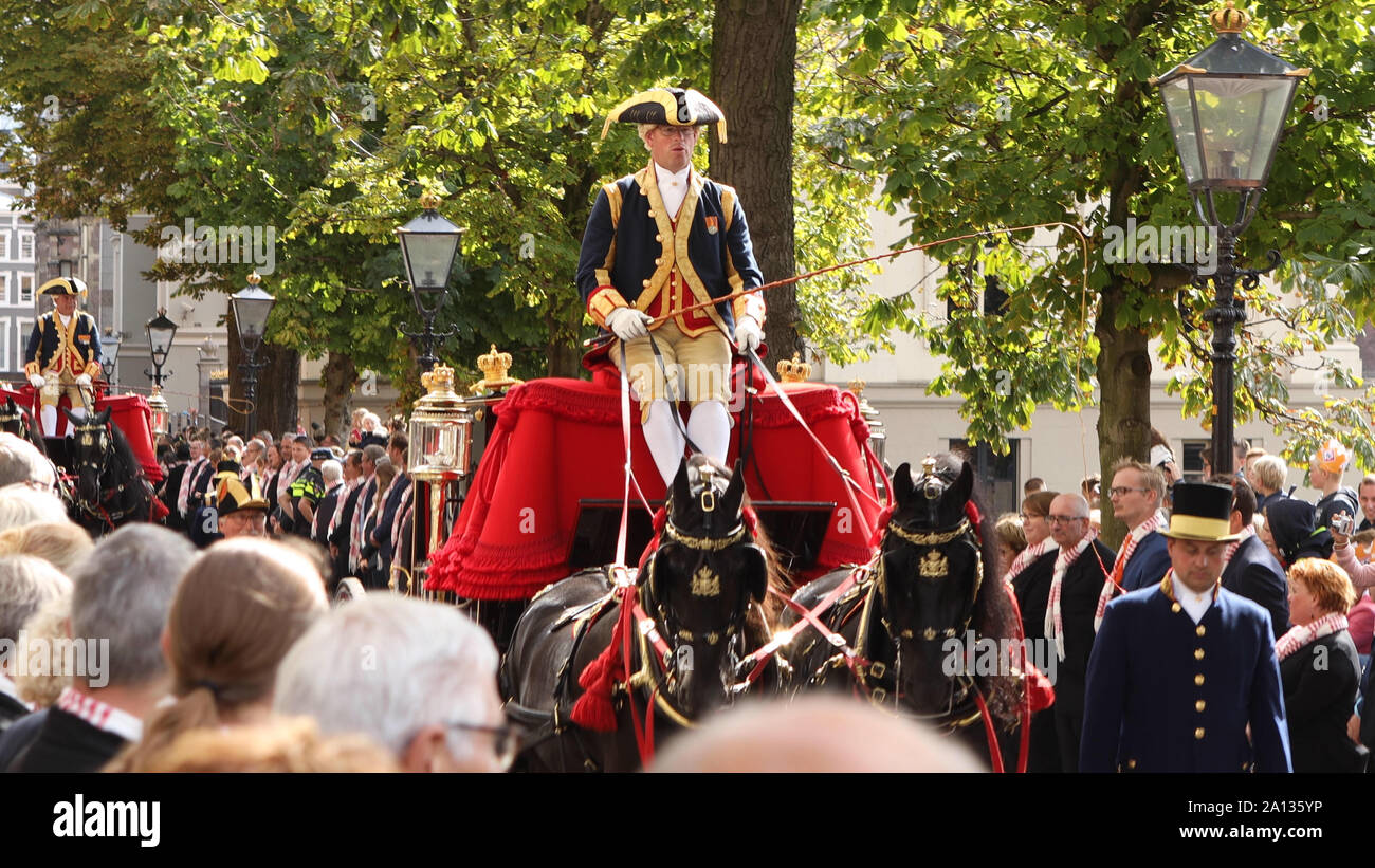 Procession of the Dutch royal family passing by in a royal horse and ...