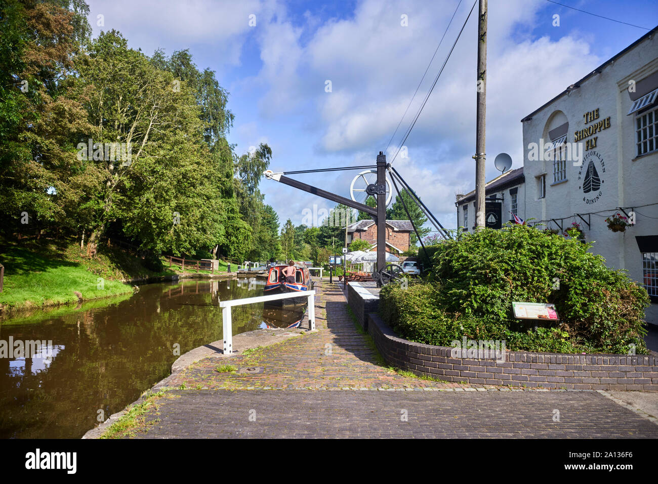 A narrowboat filling up with water outside the Shroppie Fly pub in ...