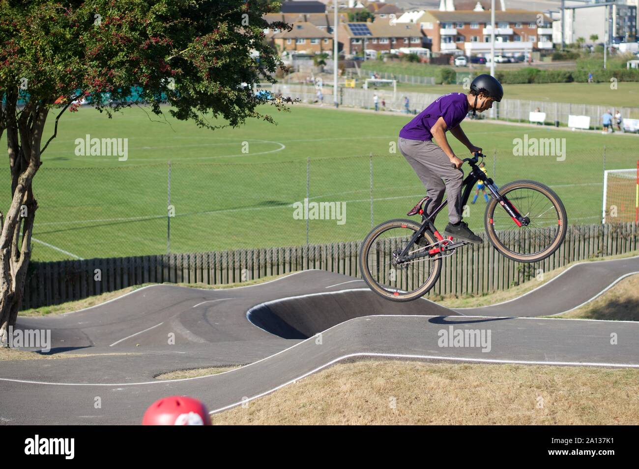 Kids riding on pump bike track Stock Photo - Alamy