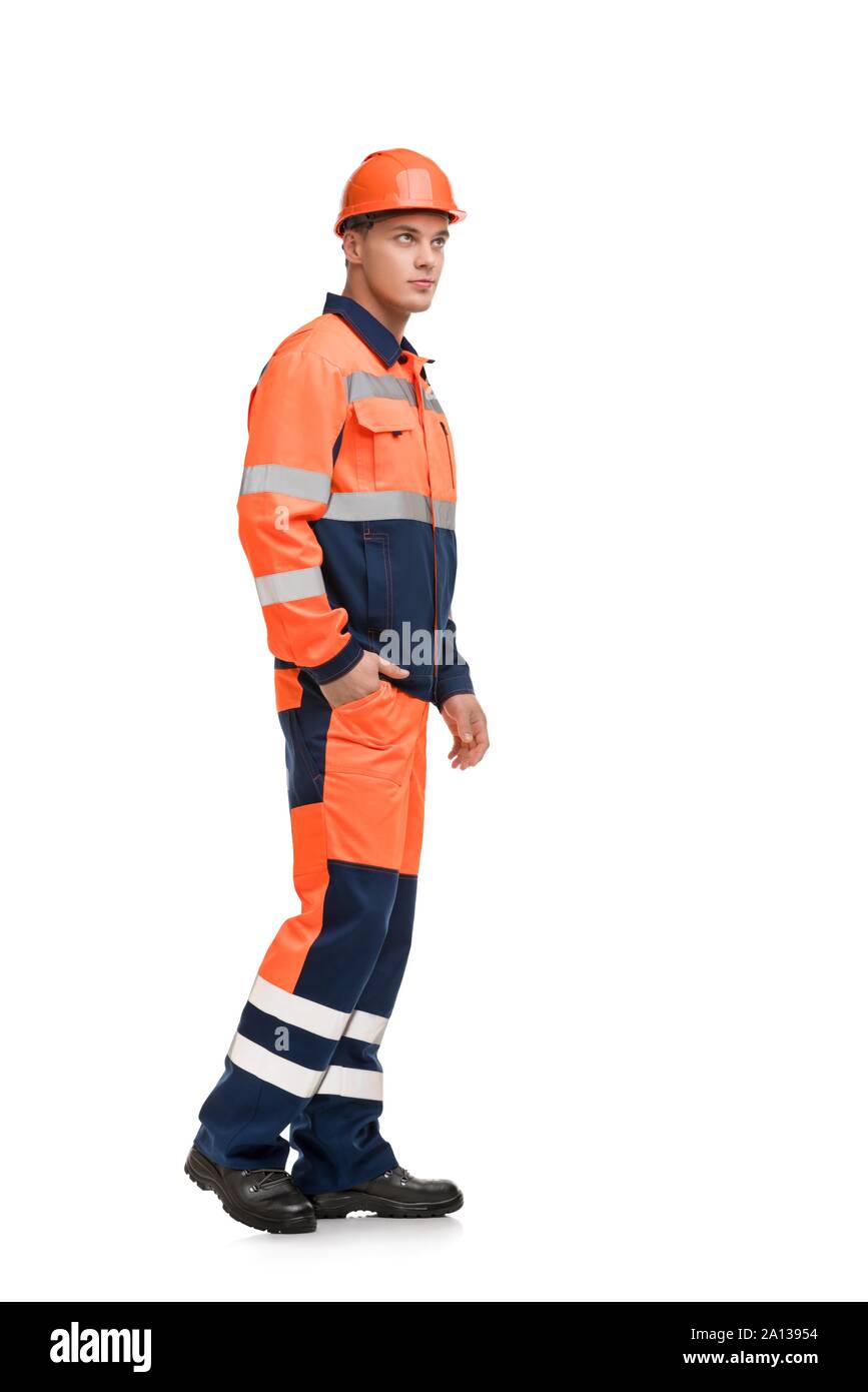 Man in working clothes and helmet profile view Stock Photo - Alamy