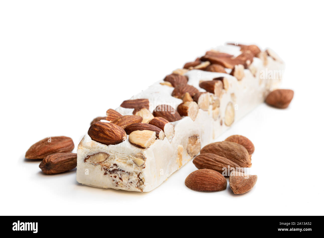 Homemade nougat bar with almonds isolated on white Stock Photo - Alamy