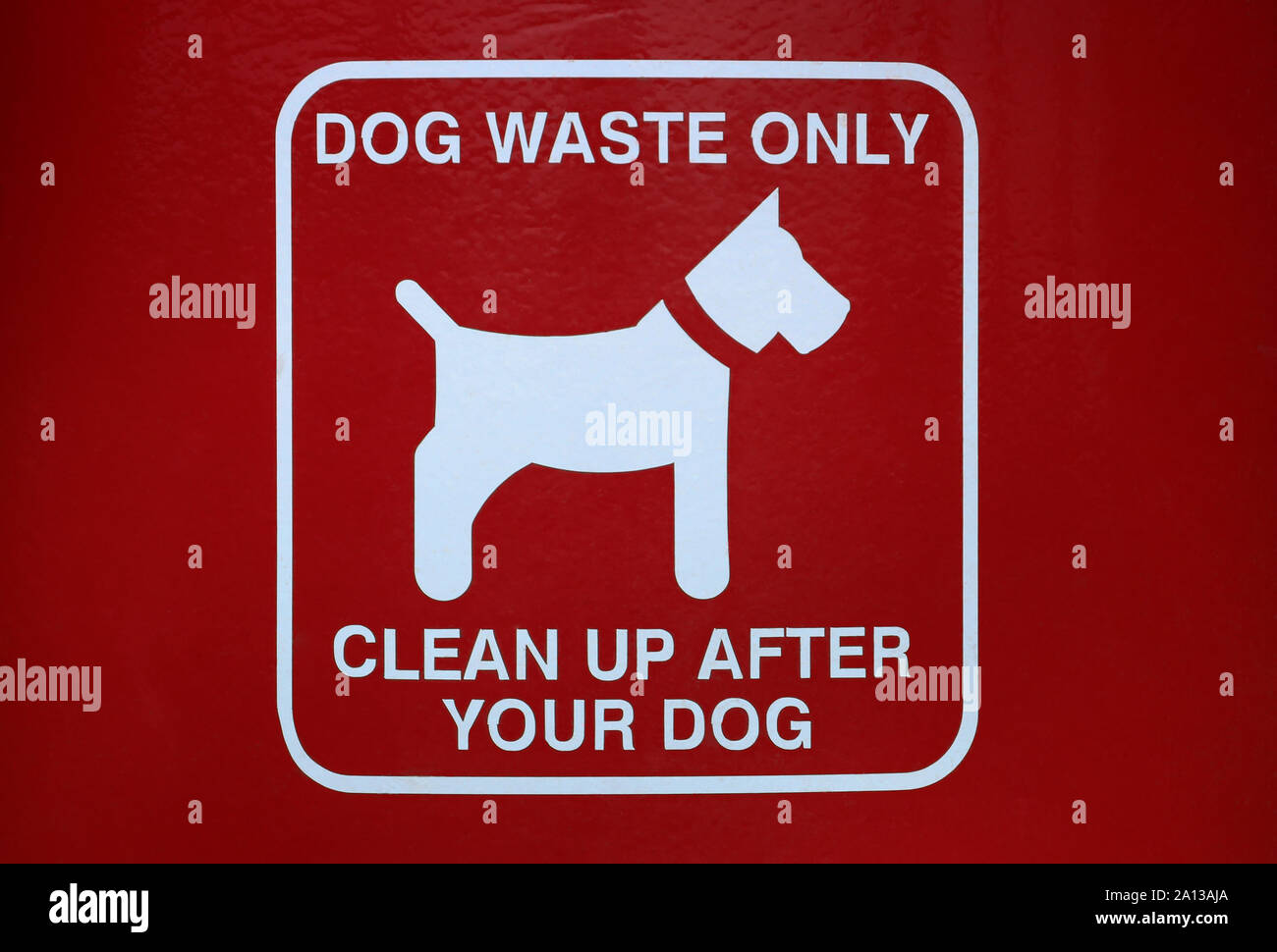 Red dog waste sign in an urban park Stock Photo - Alamy