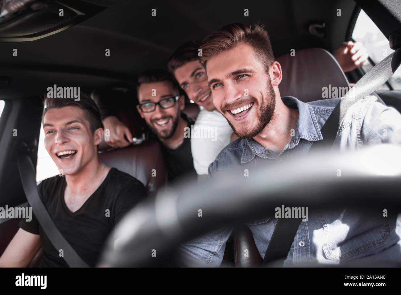 Group of happy friends on a car Stock Photo - Alamy
