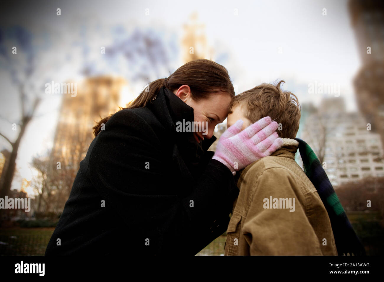 View of a mother hugging her son Stock Photo - Alamy