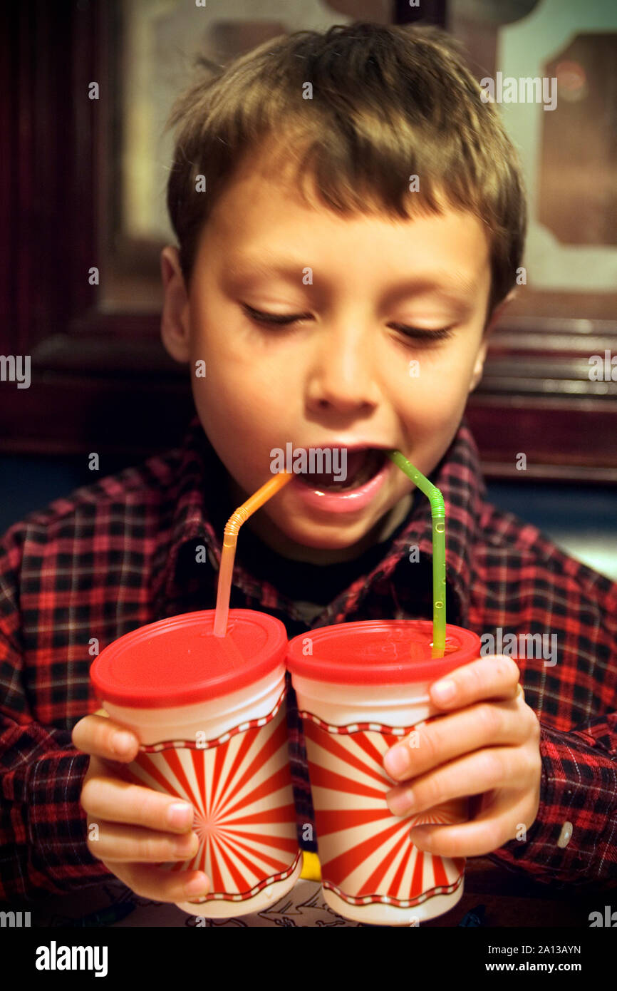 Sipping drinks straw hi-res stock photography and images - Alamy