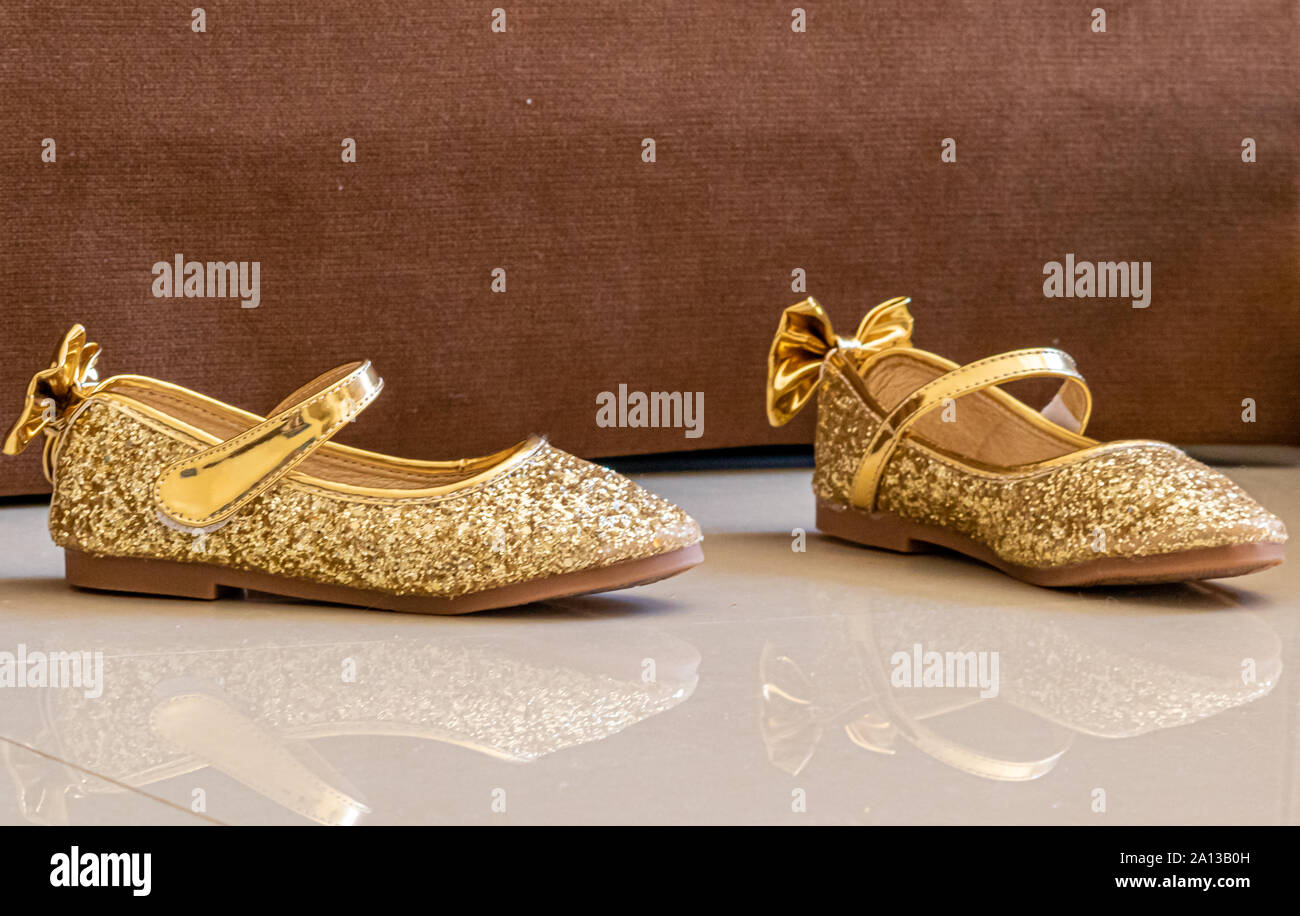 Golden shoe hi-res stock photography and images - Alamy