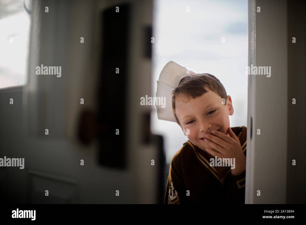 Front view of an adorable little boy wearing a cap Stock Photo - Alamy