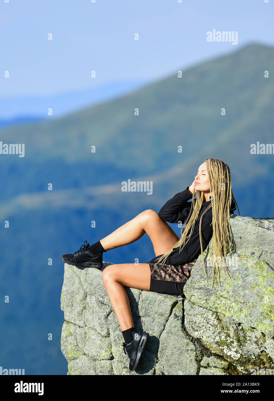 Girl Sitting On Cliff Top High Resolution Stock Photography and Images ...
