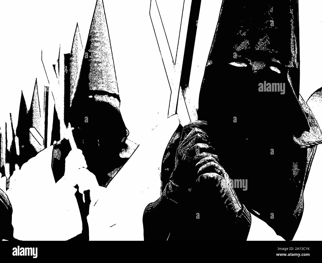 Hooded devotee, from Our Lady of Loneliness brotherhood, in a religious ...