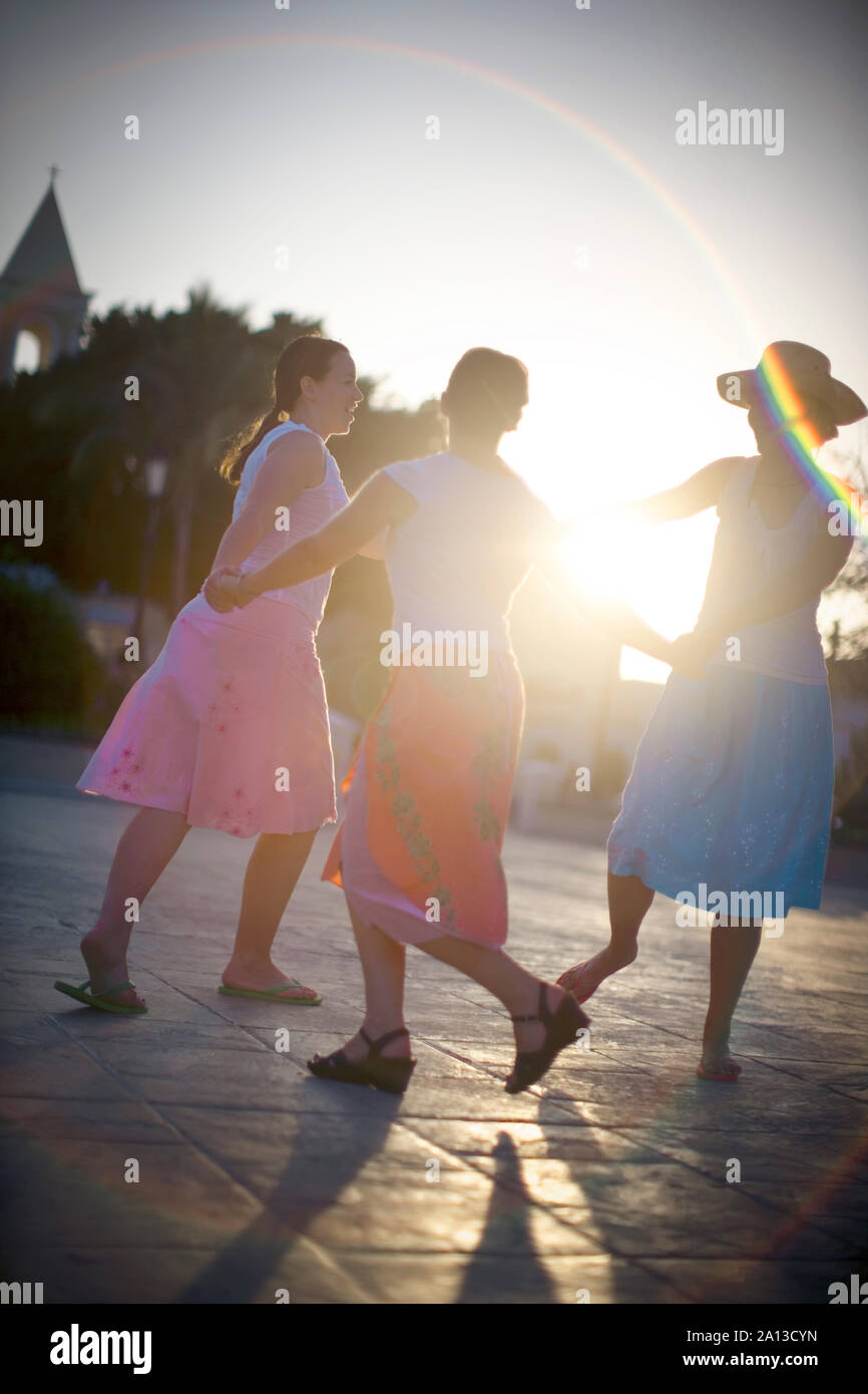 Three friends forming a circle laughs in ecstasy Stock Photo - Alamy