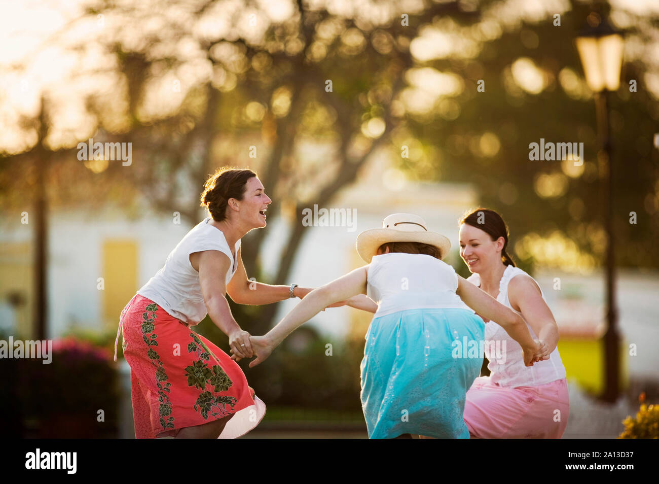 Three friends forming a circle laughs in ecstasy Stock Photo - Alamy