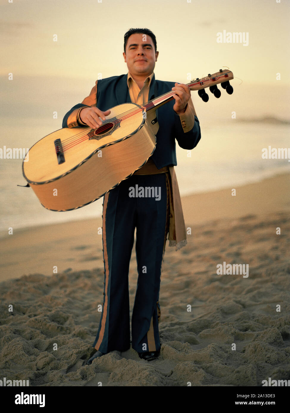 mariachi man on the beach playing the guitar Stock Photo - Alamy