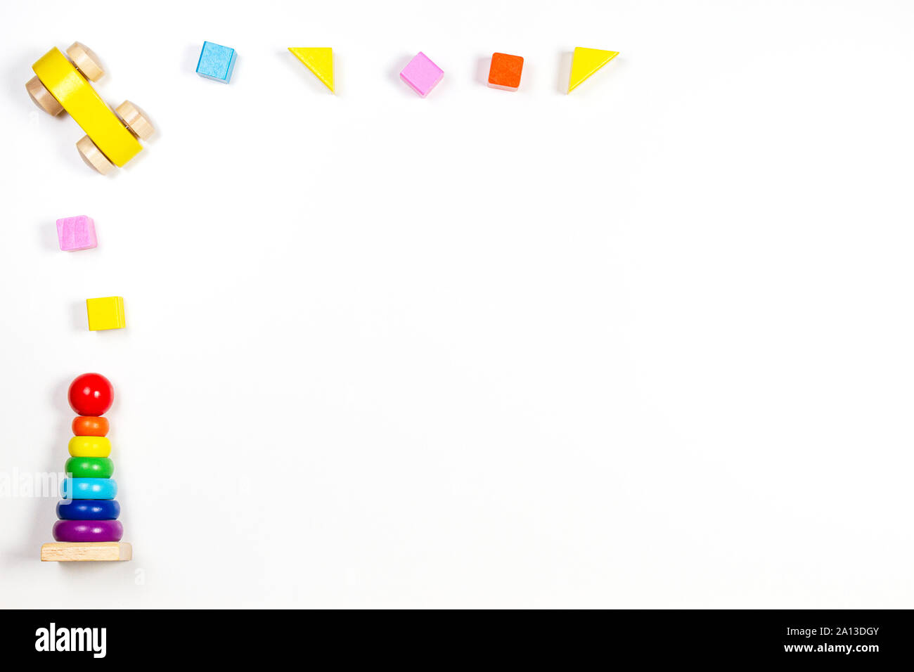 Baby kid toys background. Wooden toy car, baby stacking rings pyramid ...