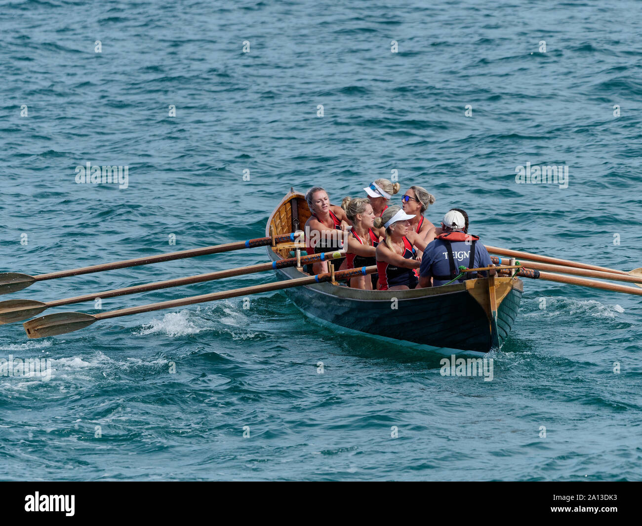 Women rowing in teams of six in traditional hand built pilot gig boats ...