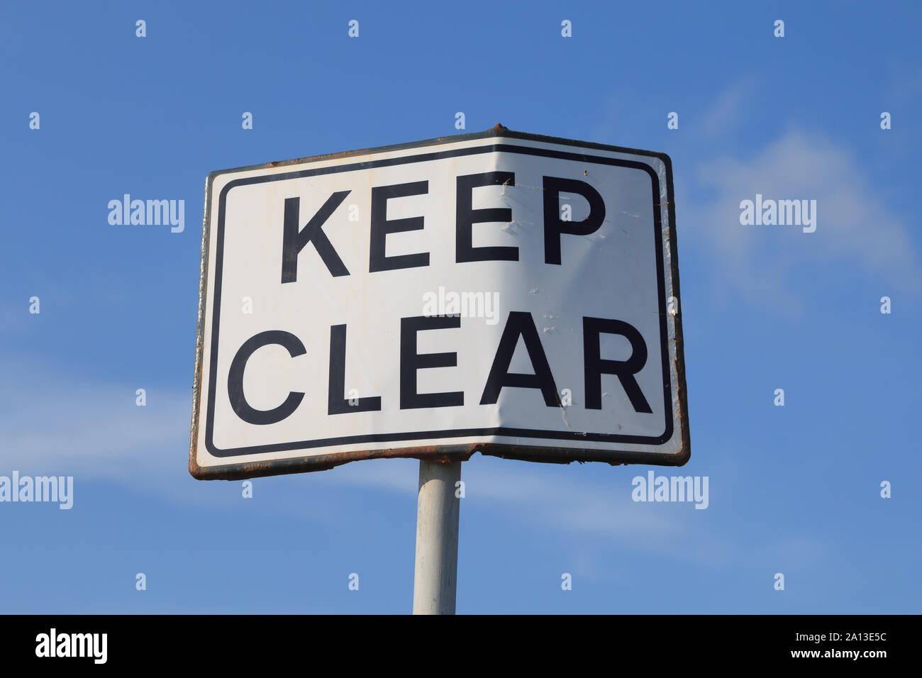 Keep clear road sign in blue sky background, horizontal Stock Photo - Alamy