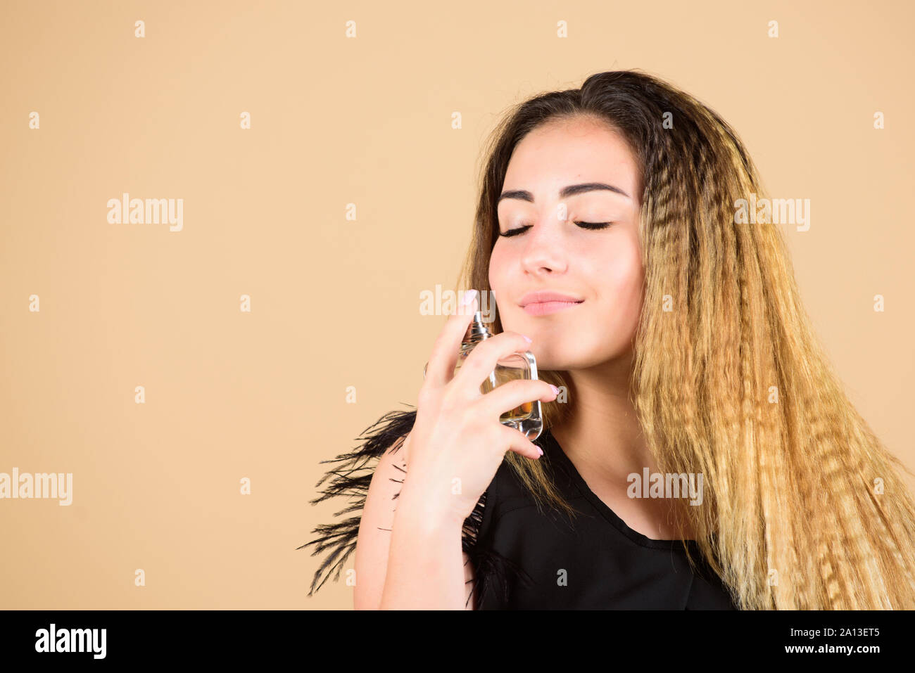 Best perfumes come in small packages. Pretty girl with bottle perfume ...