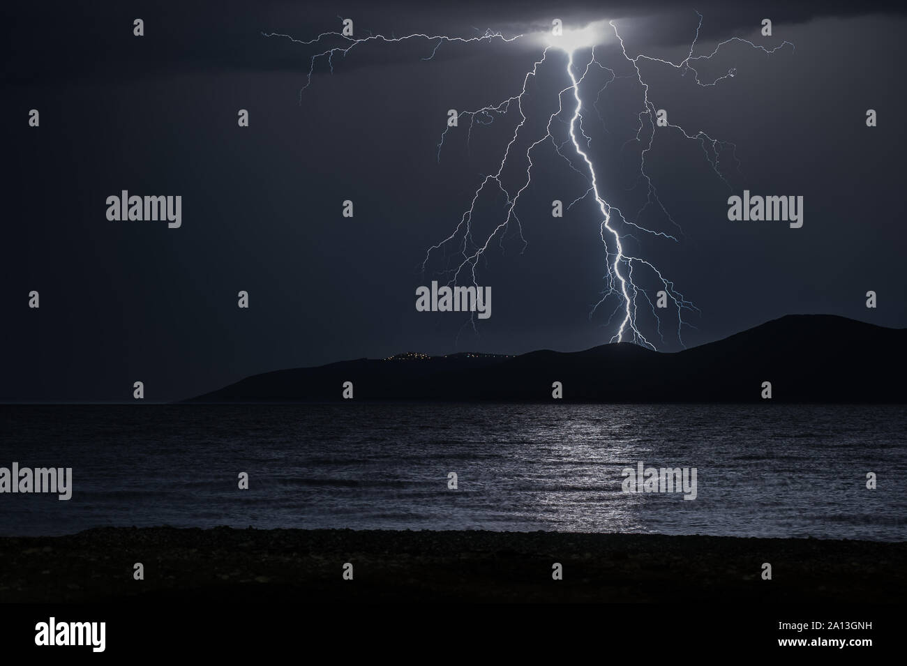 Nature's fury over Pefki, North Evia: A lightning bolt cleaves the ...