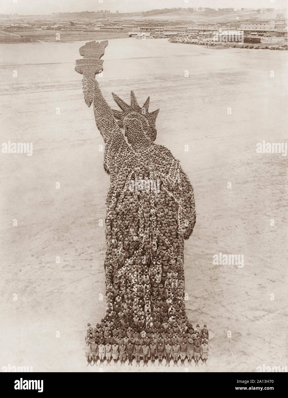 An aerial view of a human formation of the Statue of Liberty composed ...