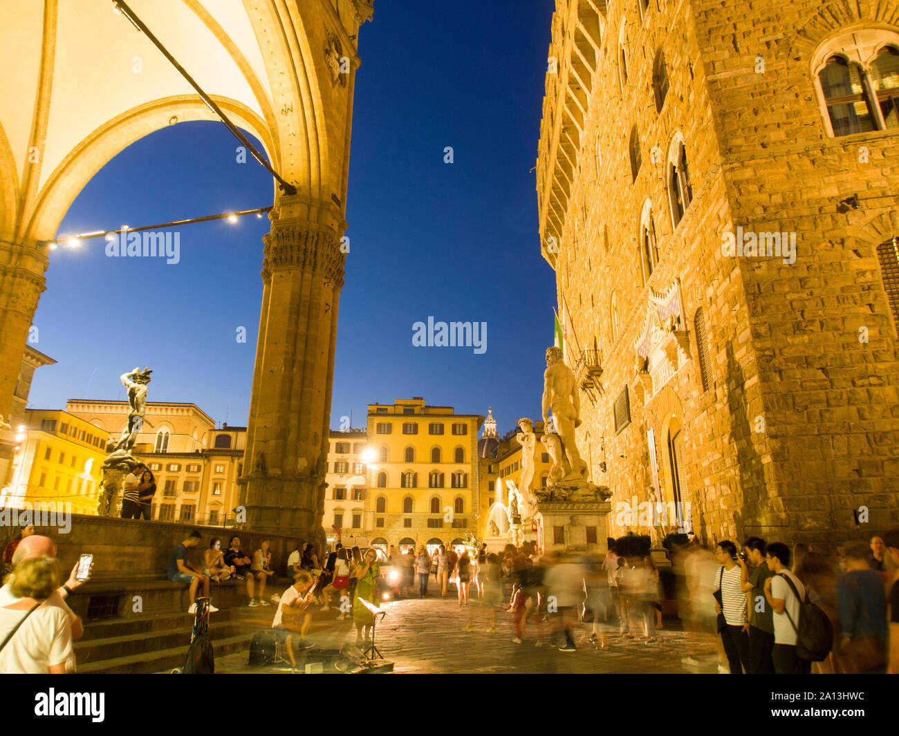 Italy, Florence,the Signoria square and Palazzo Vecchio with tourists ...
