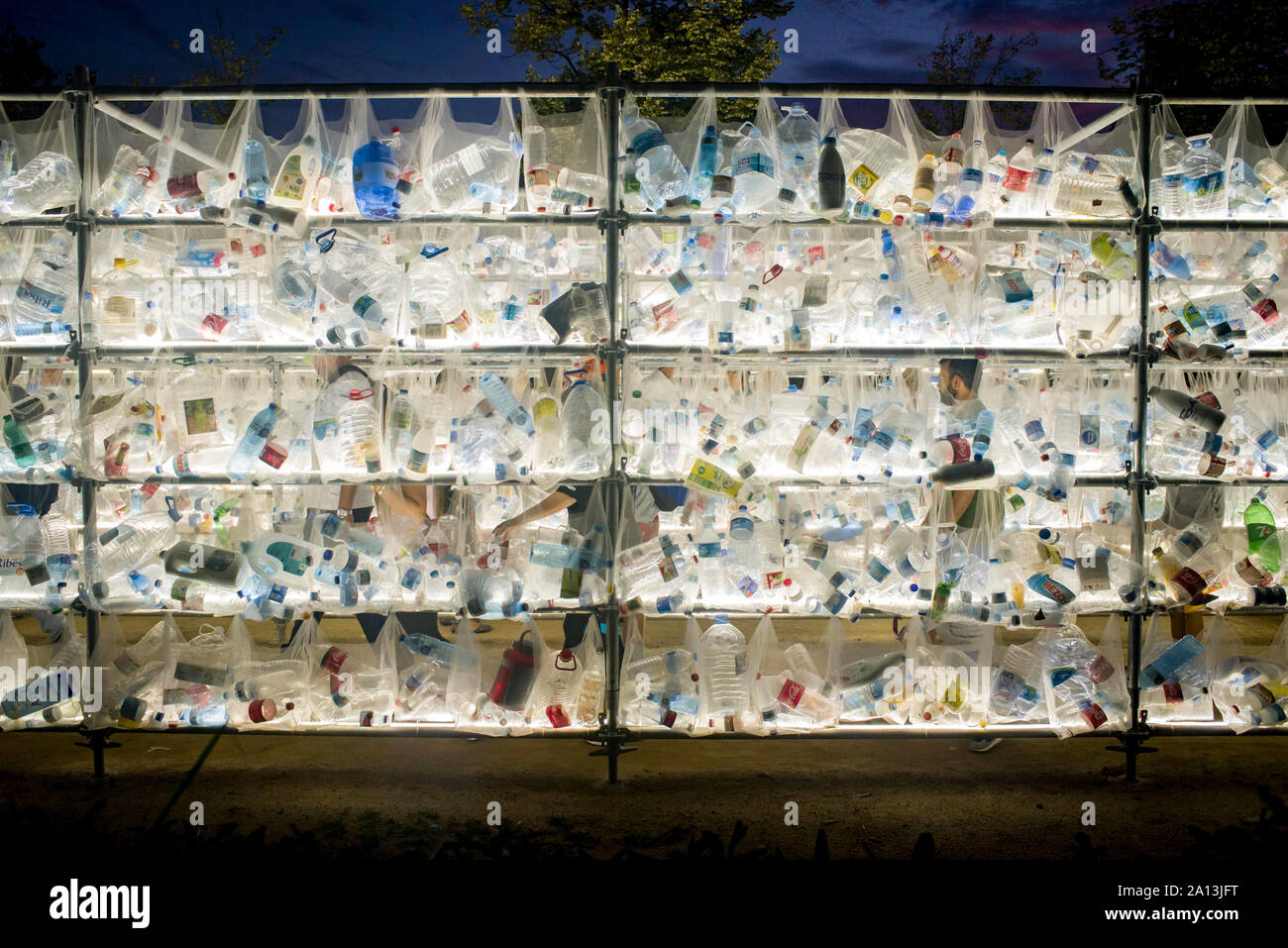 Barcelona, Catalonia, Spain. 23rd Sep, 2019. People passes by a light ...