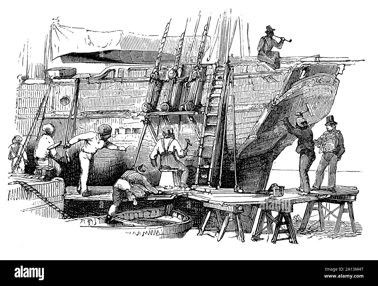 Caulkers working in the process of sealing a wooden boat watertight ...